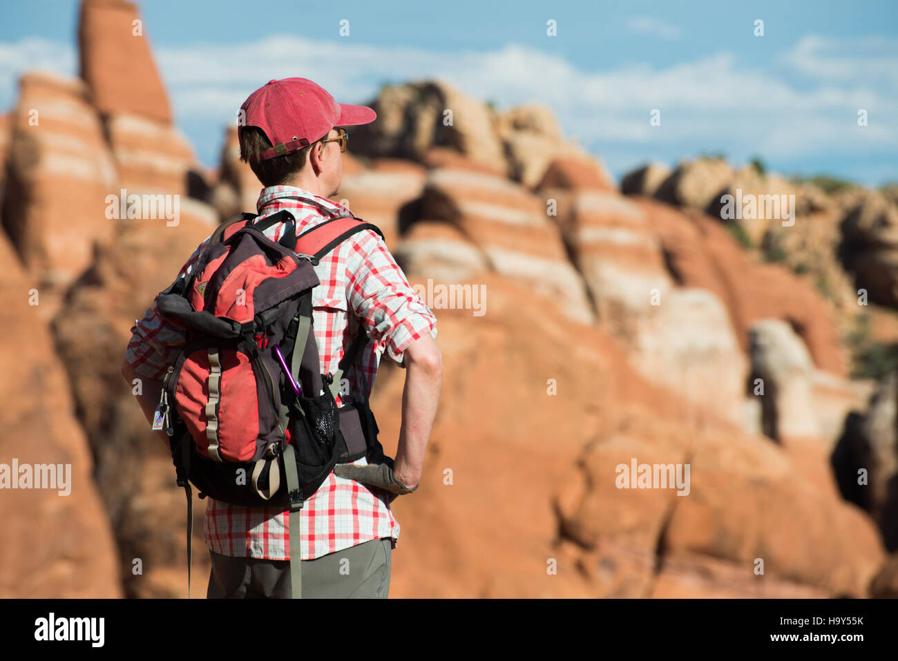Visitors take in the stunning views of the Fiery Furnace in Arches ...