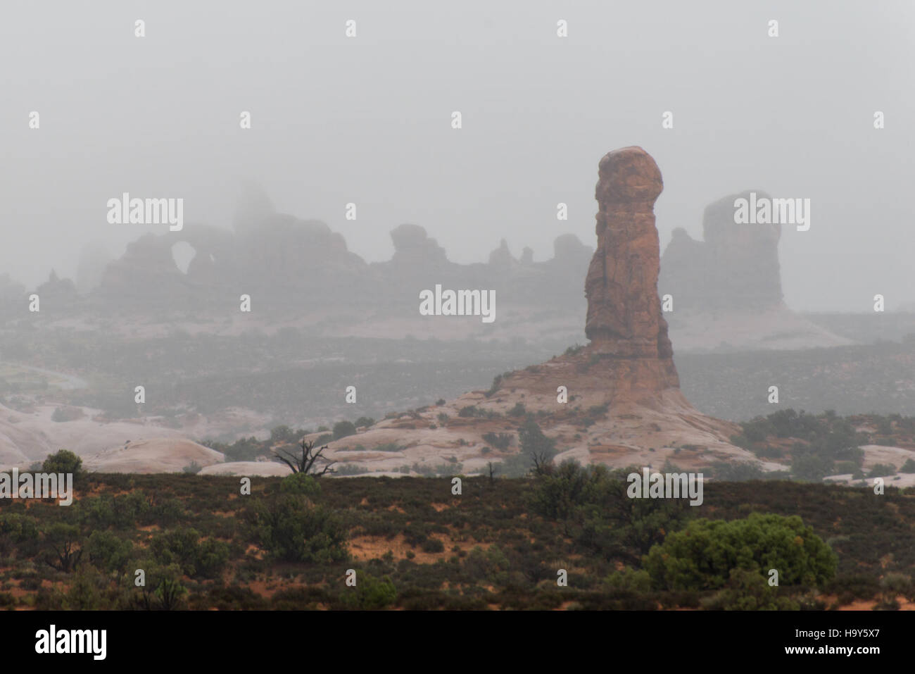 Turret Arch, located in Arches National Park, is visible through a ...