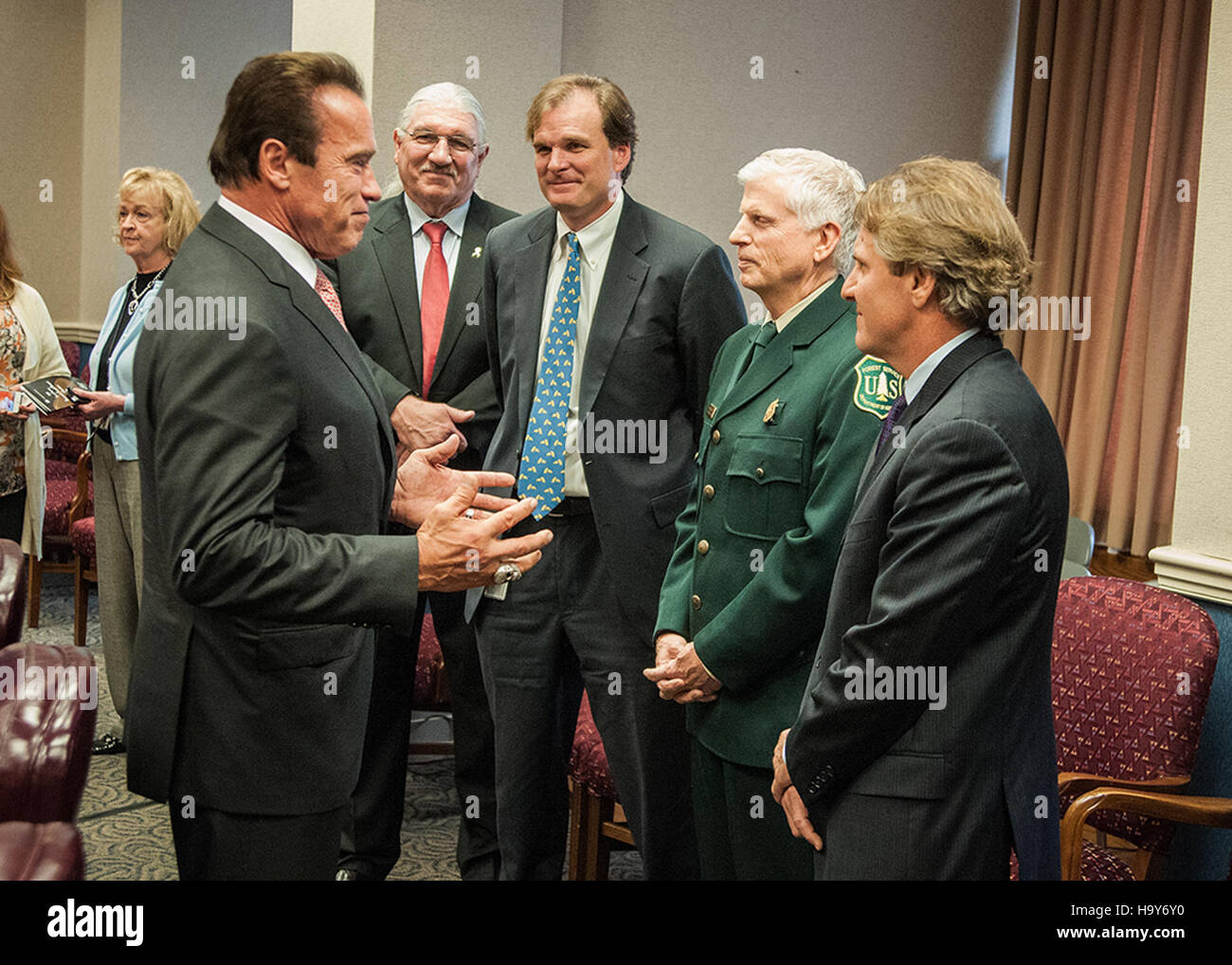 A meeting is held at the USDA with key officials, including Arnold ...