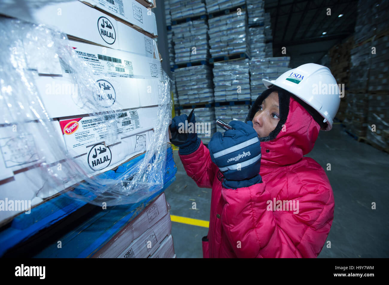 This image depicts a USDA Food Safety Inspection Service inspector ...
