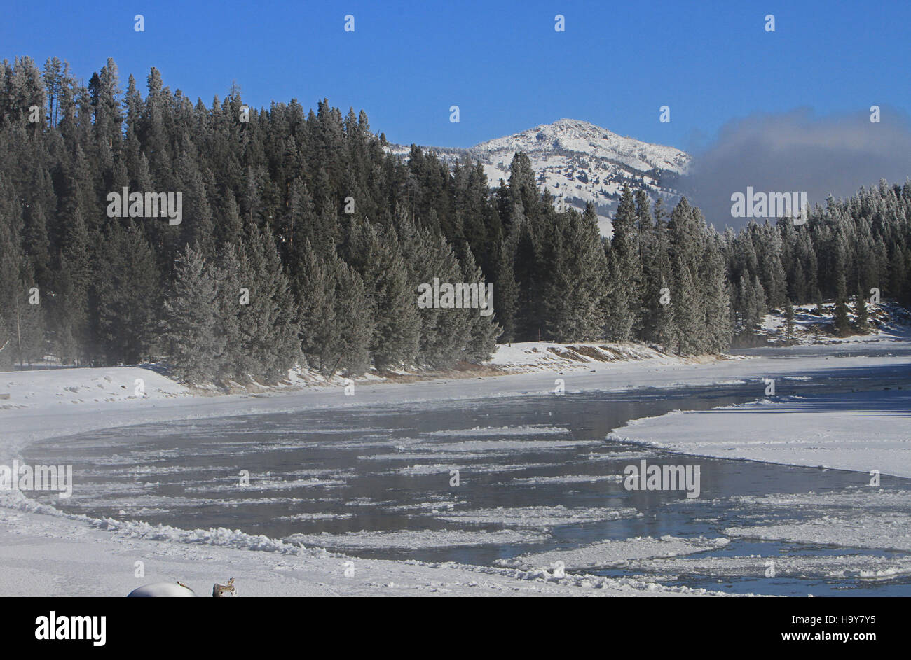 This image captures the winter scene of Dunraven Peak and the ...
