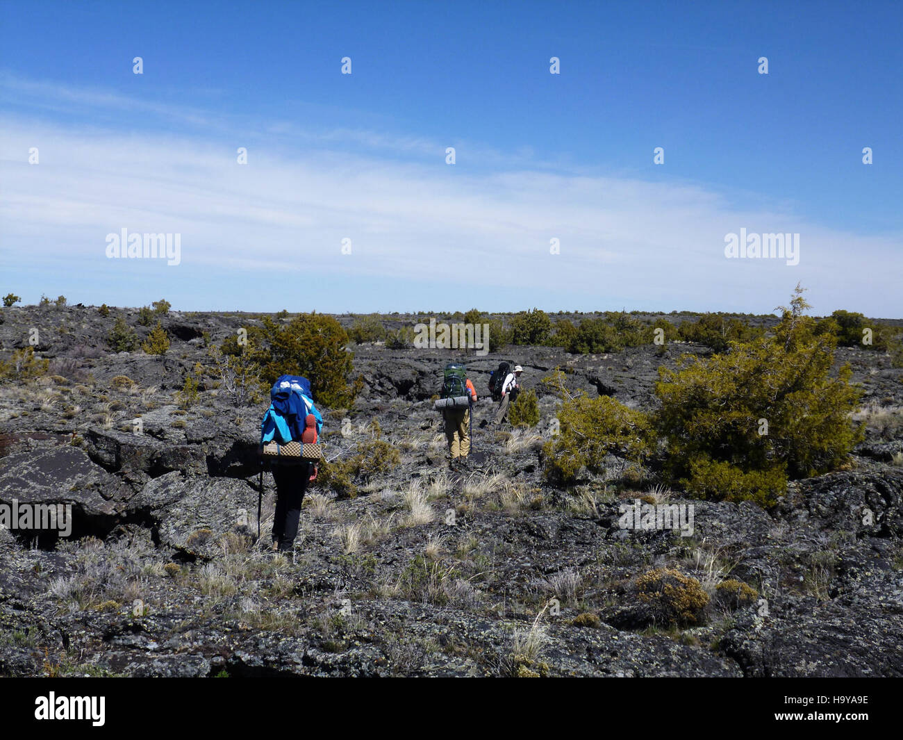 cratersofthemoonnps 13956007762 hiking thru lava Stock Photo - Alamy