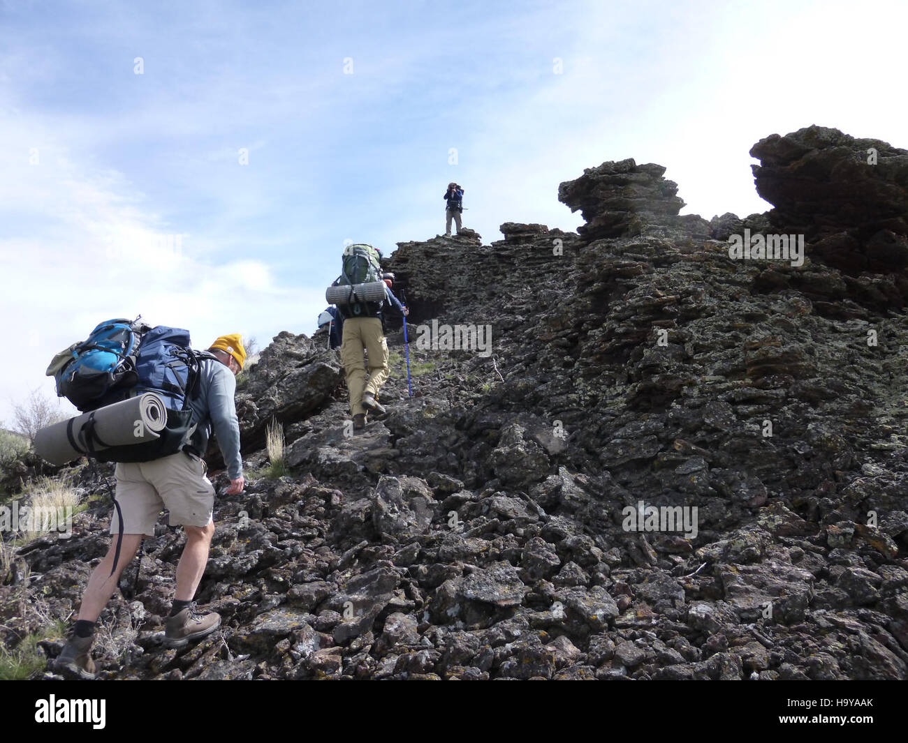 A photograph showcasing the view from the top of a volcanic cone in the ...