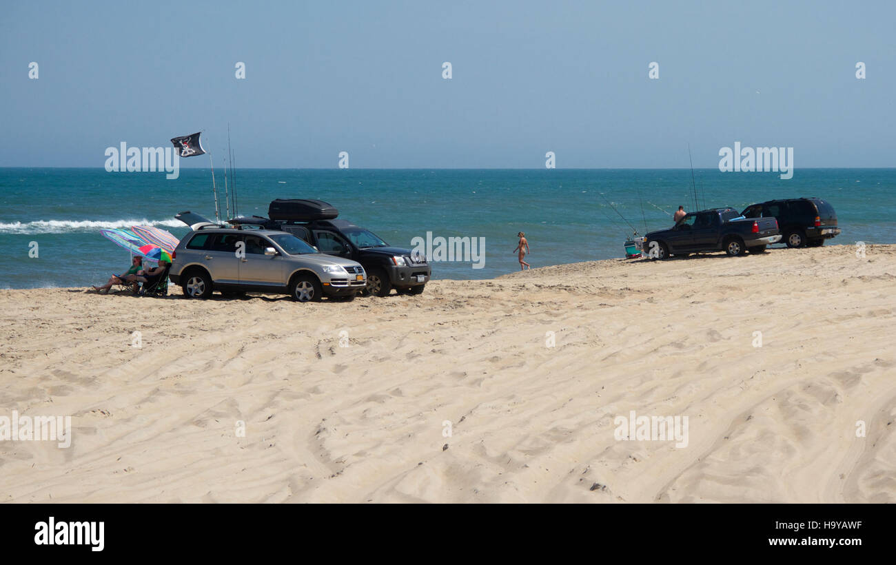 A scene from Cape Hatteras National Seashore, depicting a lively beach ...