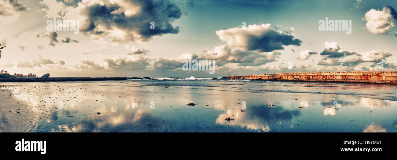 Panoramic view of abandoned pier at sunset in Guanabo beach with ...