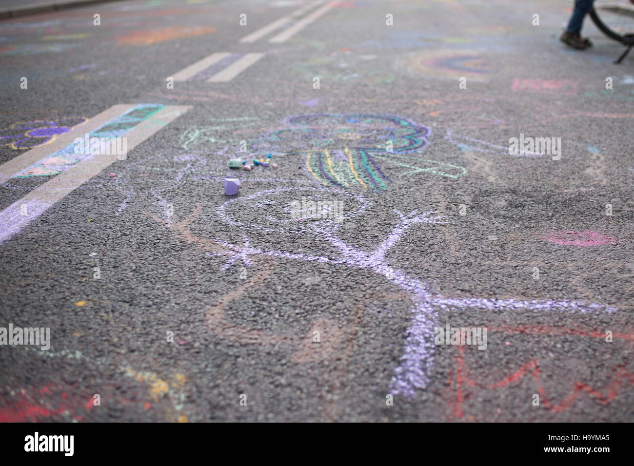 Children's drawing with chalk on a street with purple chalk Stock Photo ...