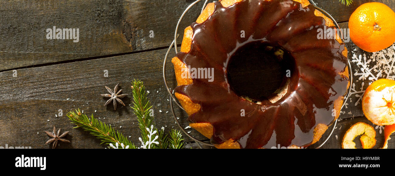 Christmas frame. Traditional homemade cupcake with chocolate icing ...