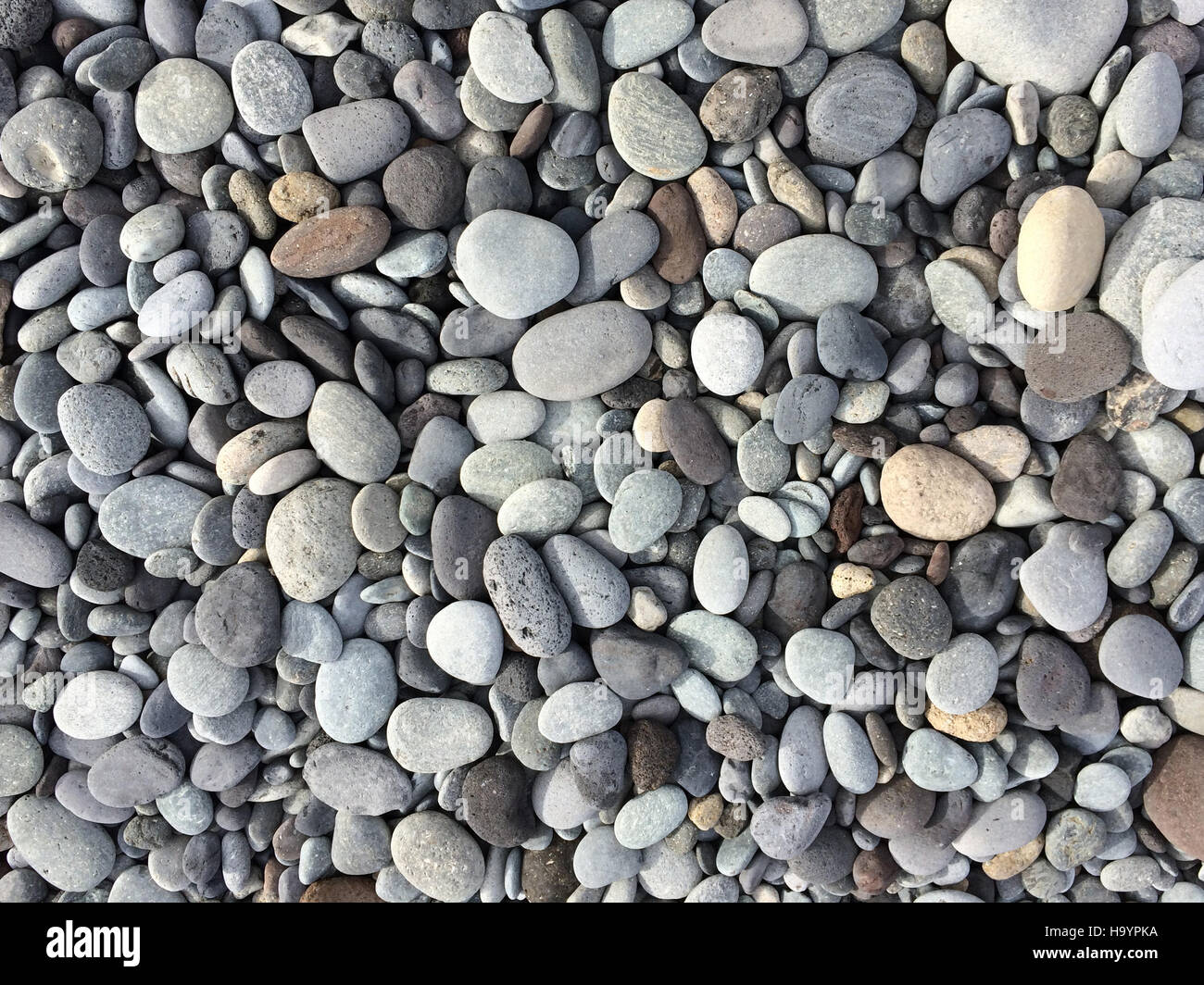 pebble stone background - pebble stone beach Stock Photo - Alamy
