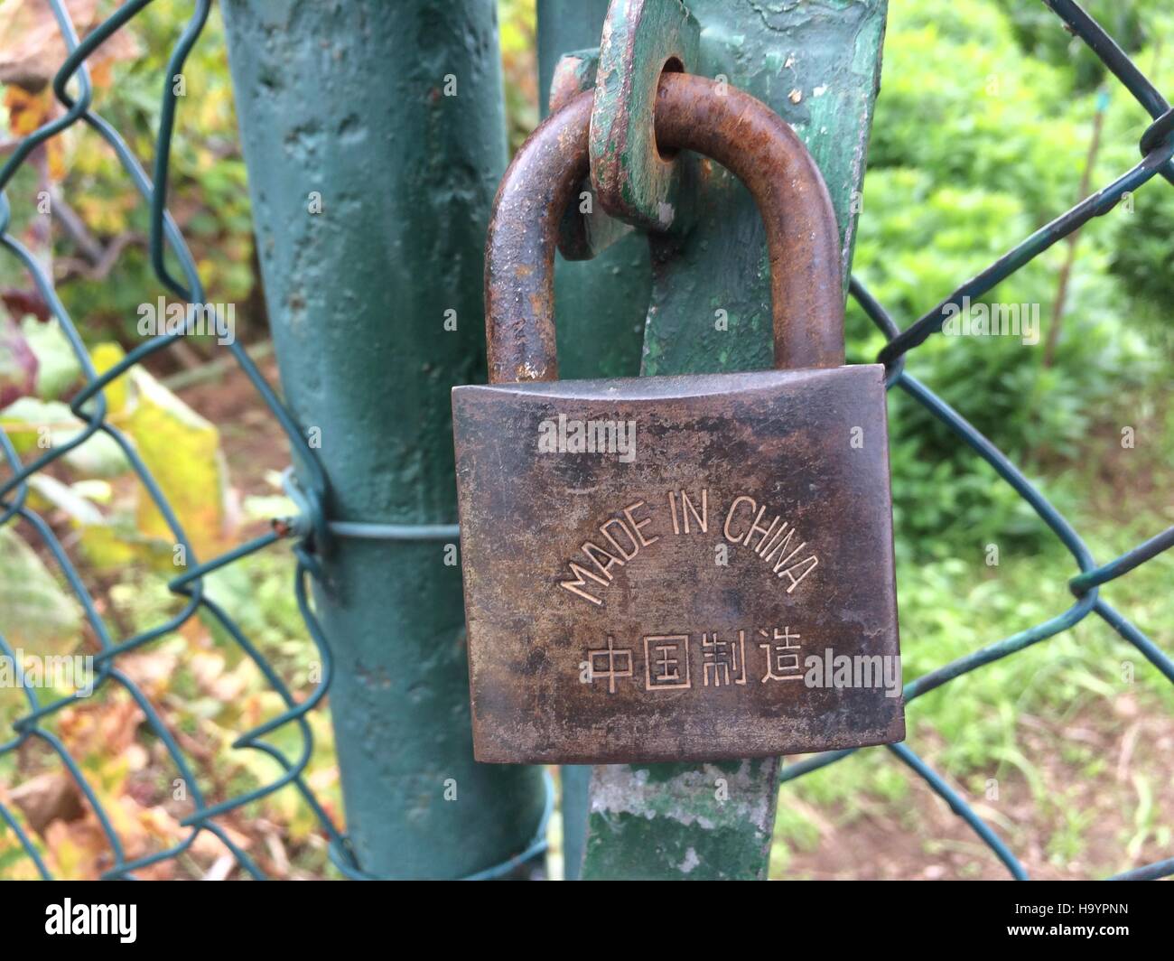 old rusty padlock made in china lock Stock Photo - Alamy