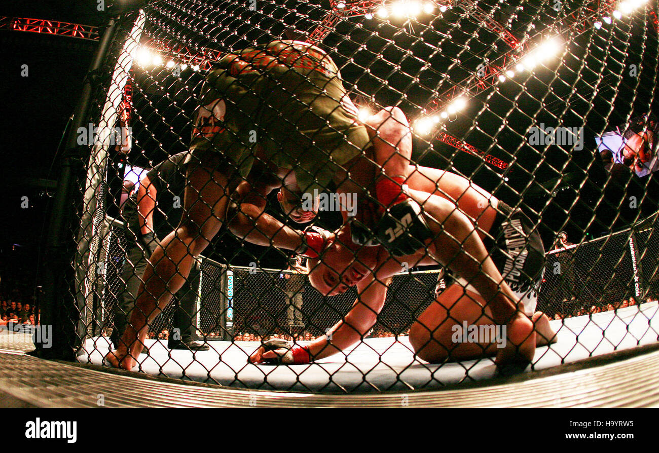 Tito Ortiz (blonde hair) and Rashad Evans grapple during UFC 73 at the ...