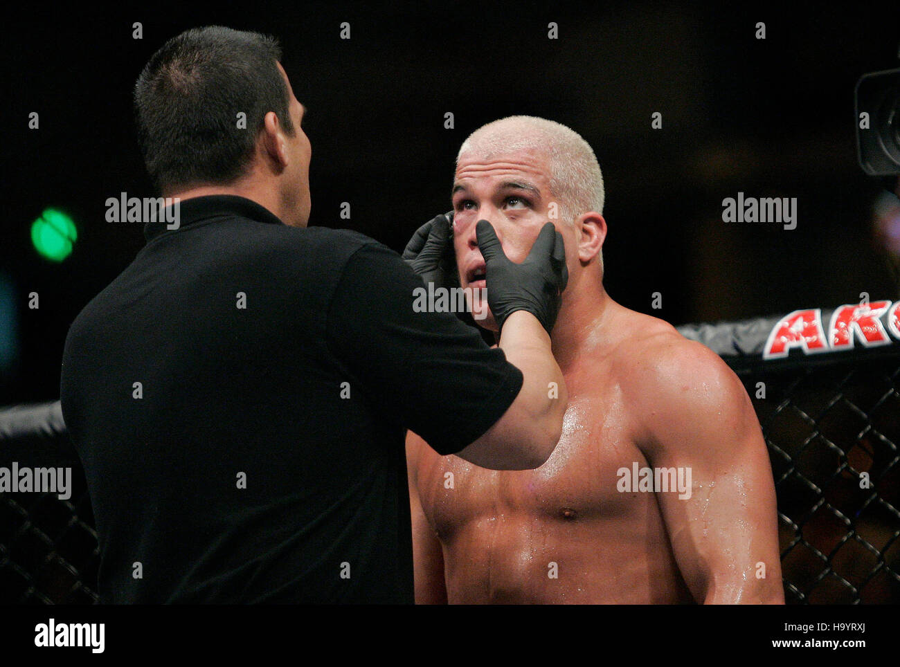 Tito Ortiz is checked by the referee during UFC 73 at the Arco Arena in ...