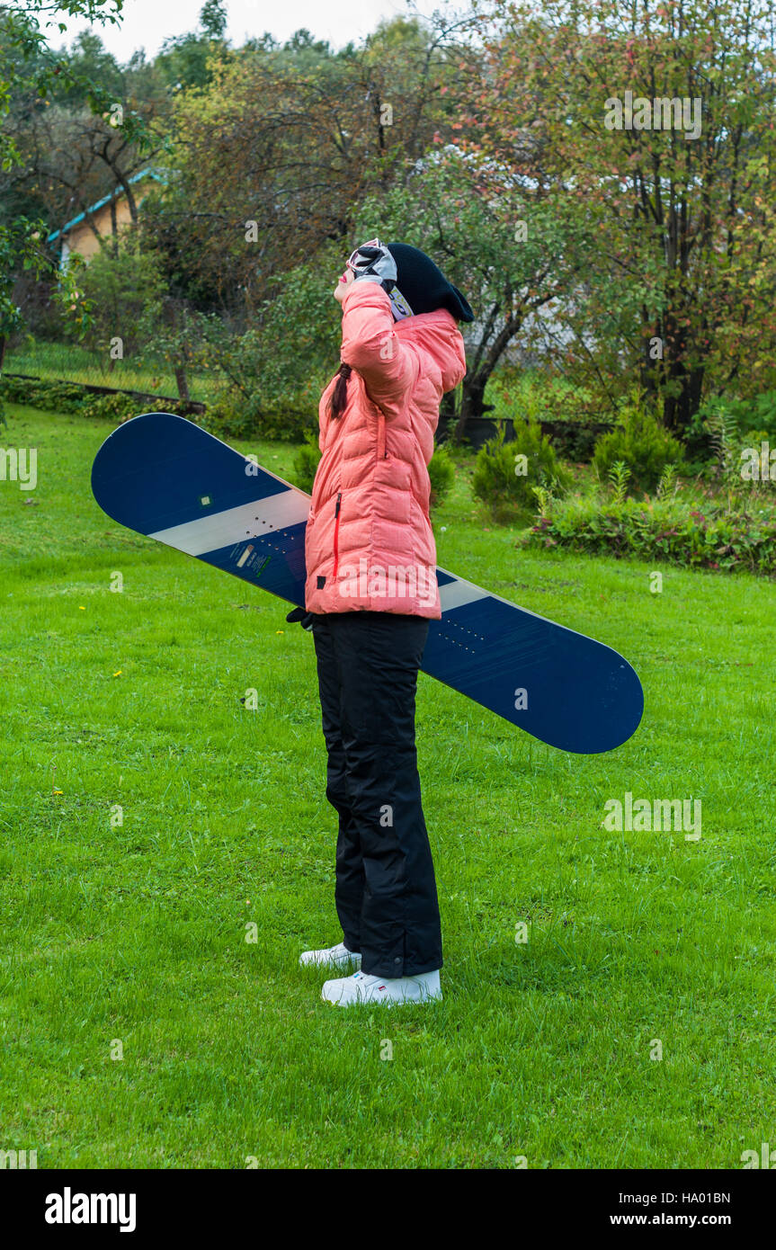 Smiling snowboarding girl with red lipstick Stock Photo - Alamy