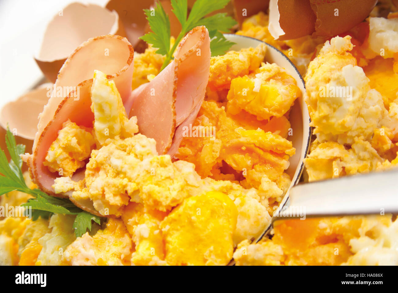 Scrambled eggs and cooked ham Stock Photo - Alamy