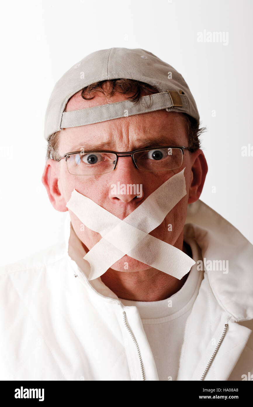Painter with adhesive tape over his mouth Stock Photo - Alamy