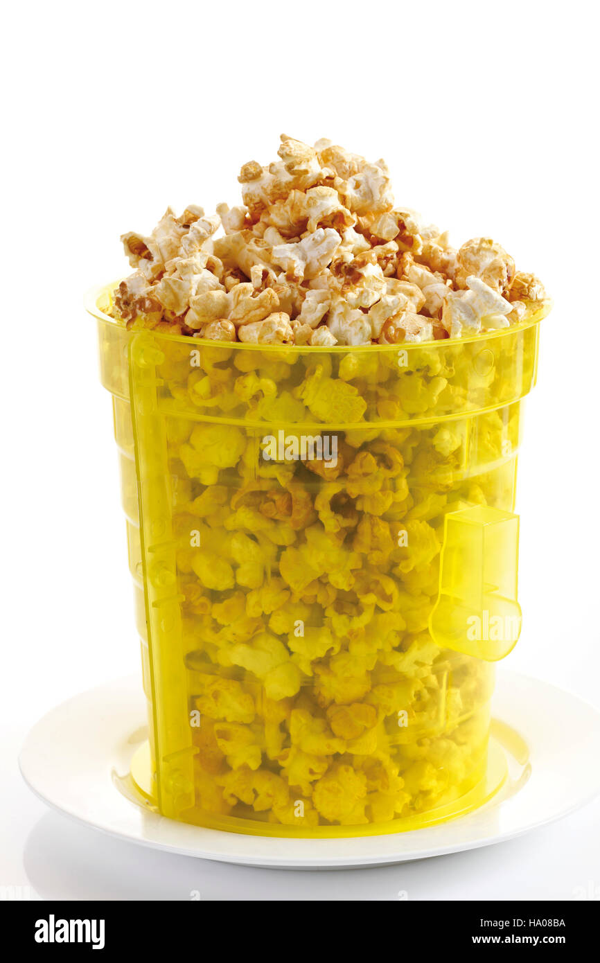 Popcorn in a yellow plastic bucket Stock Photo - Alamy