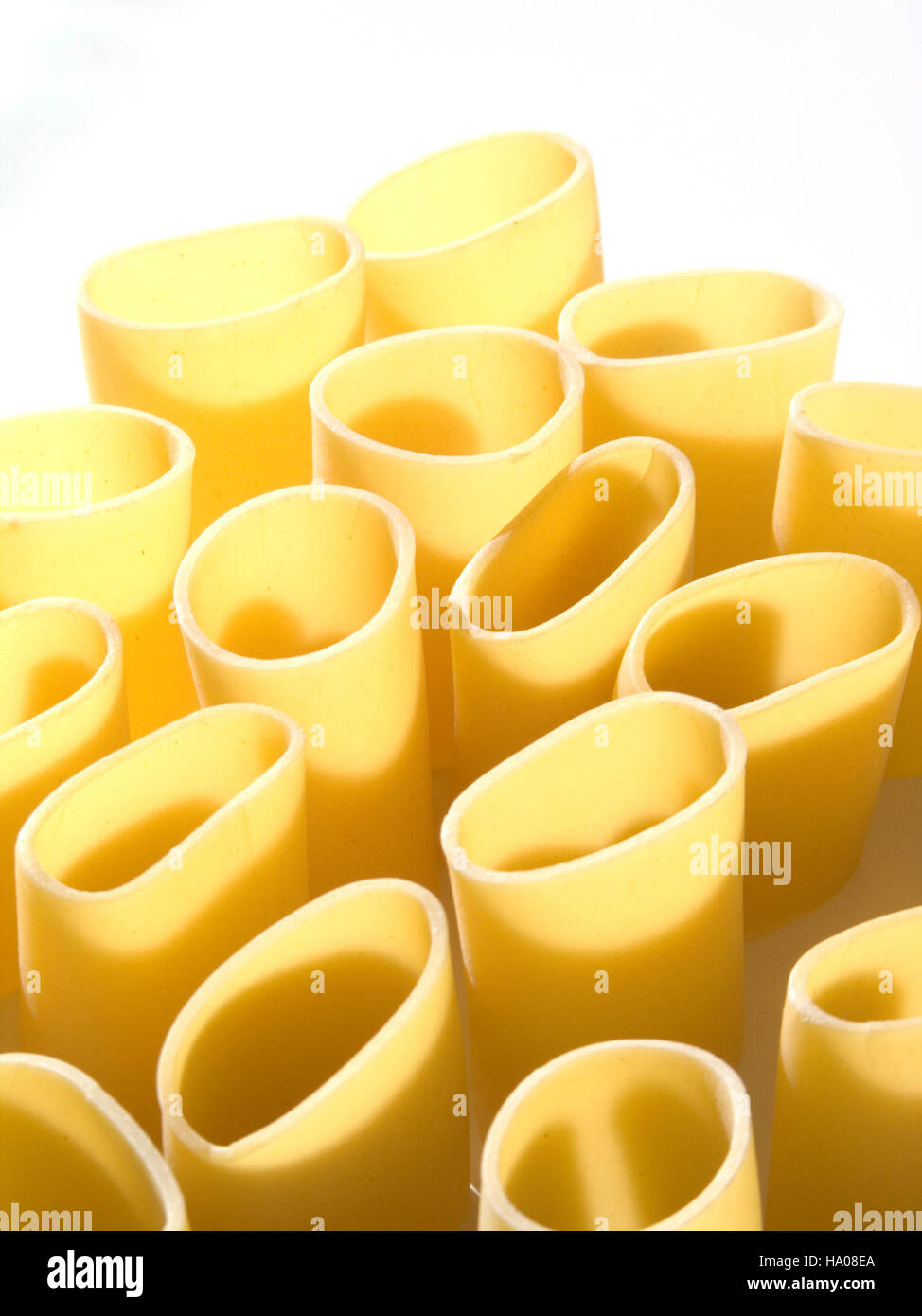 Maccaroni composition on a white background Stock Photo - Alamy