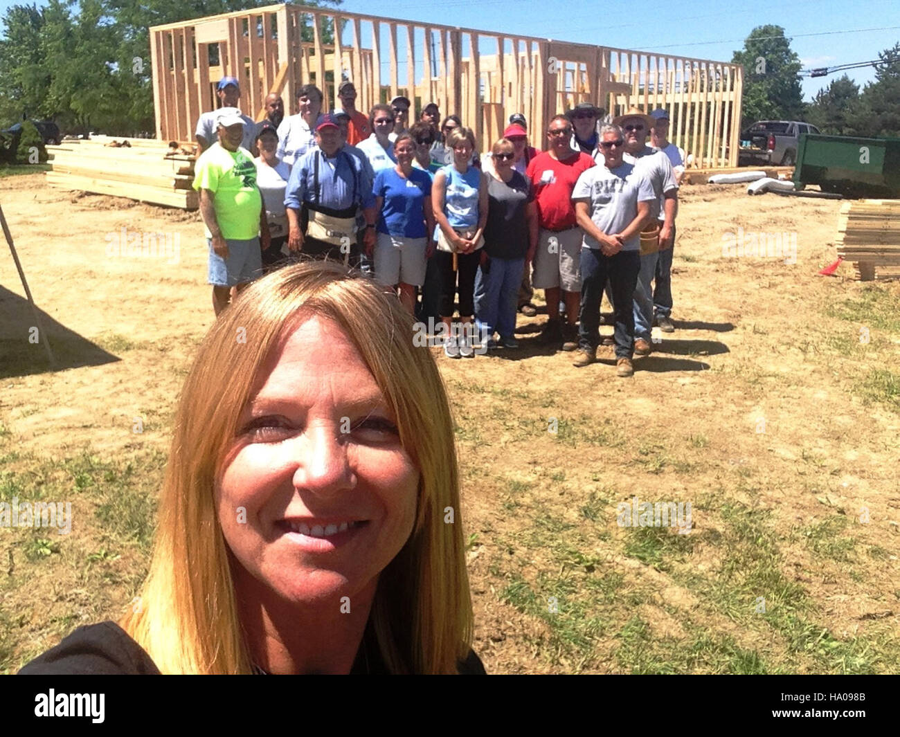 In Ohio, Michelle Amrine and staff builders capture a selfie while ...