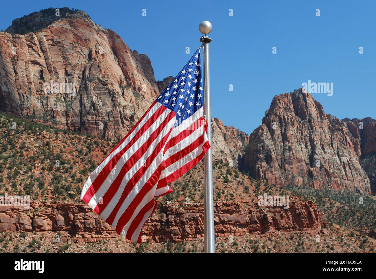 The American Flag stands proudly in Zion Canyon, symbolizing the ...