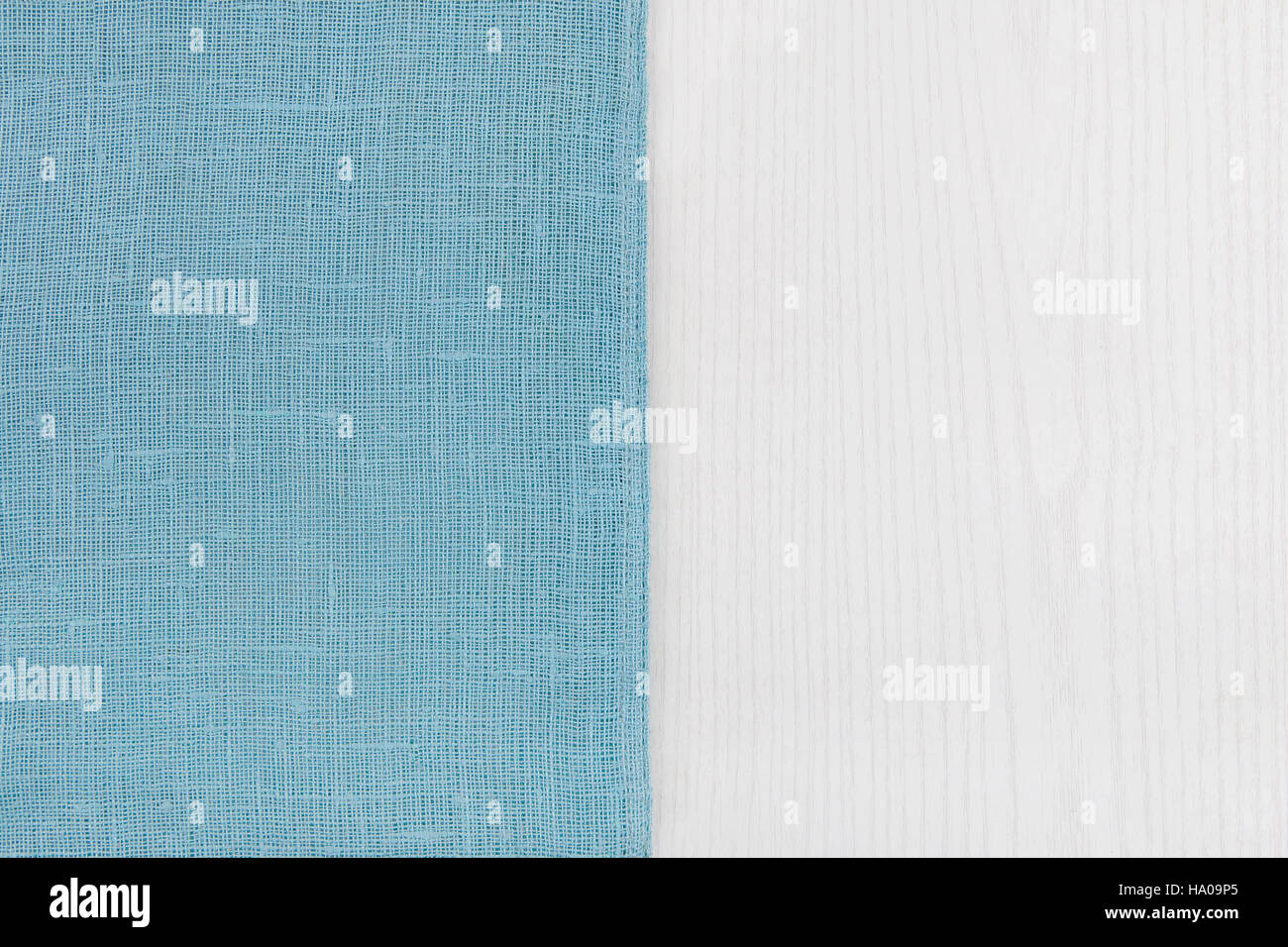 Sack from left side white wooden table.Soft blue woven linen fabric ...