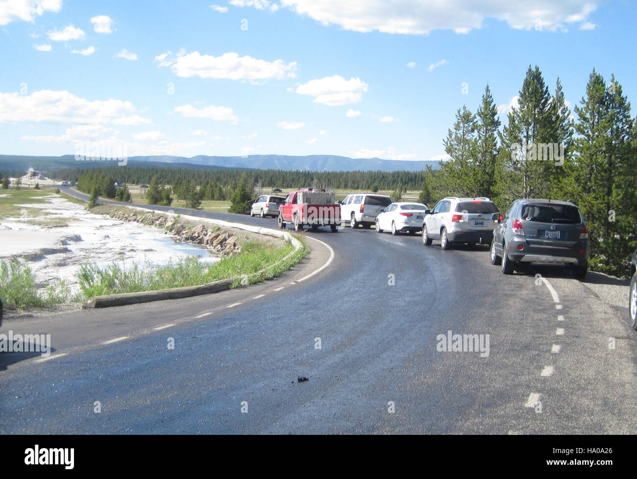 A scenic photograph from Yellowstone National Park showcases its iconic ...