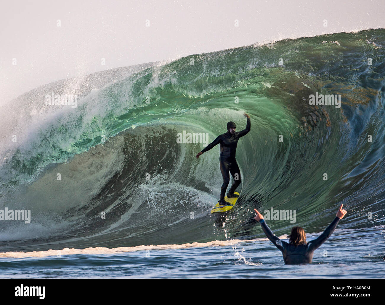 usdagov 18228058892 Man riding wave and another man in the water Stock ...