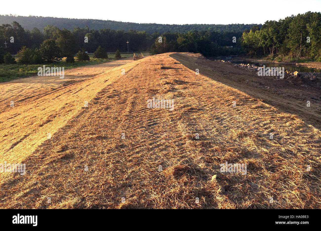 The image highlights the completion of a new levee, which is part of ...