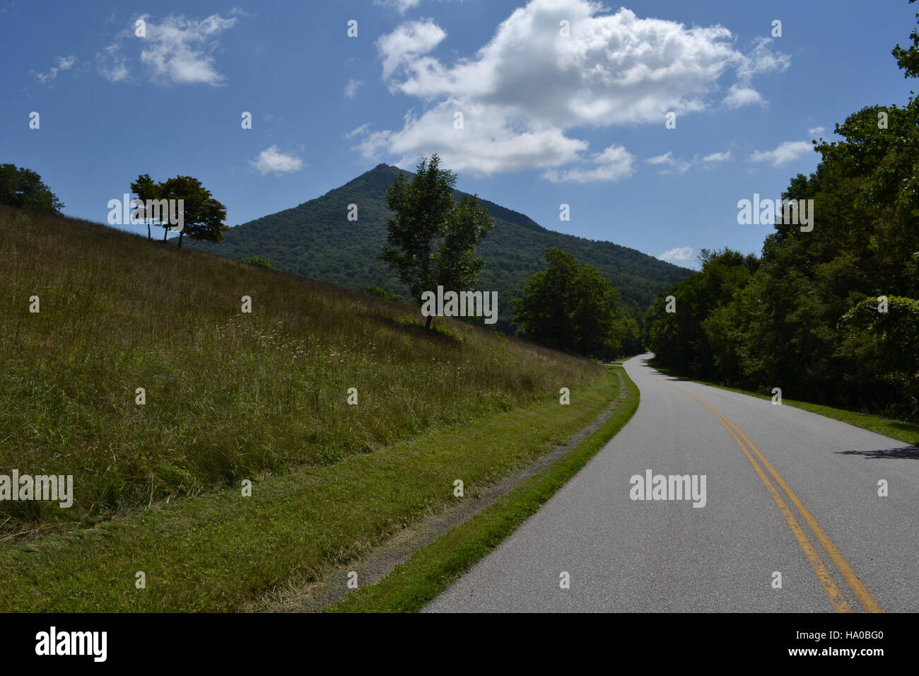 A scenic photo of Sharp Top Mountain showcases the rugged beauty of the ...