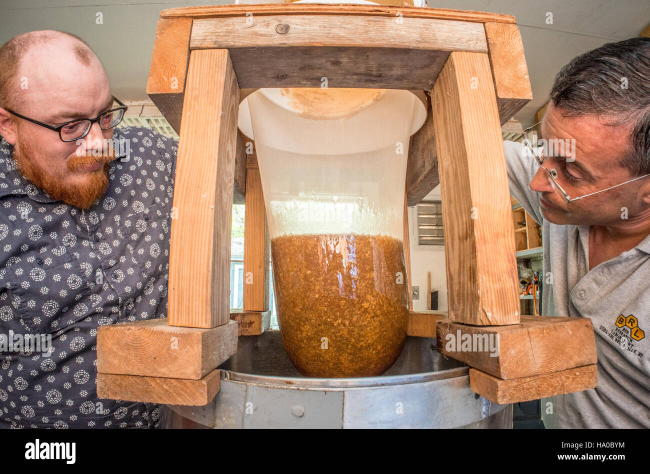 This image shows the process of honey extraction at the U.S. Department ...