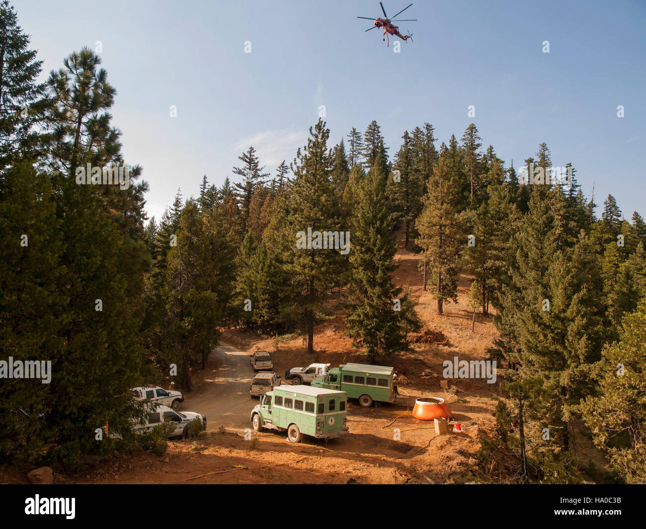 Firefighters at the Happy Camp Complex engage in wildfire management operations, using ...