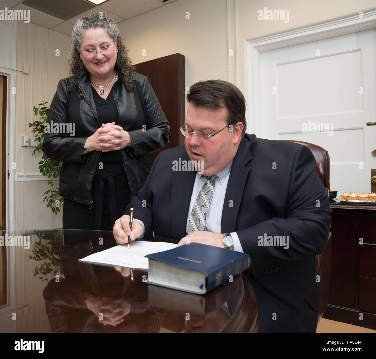 This photo captures the swearing-in ceremony of Holladay, a key figure ...
