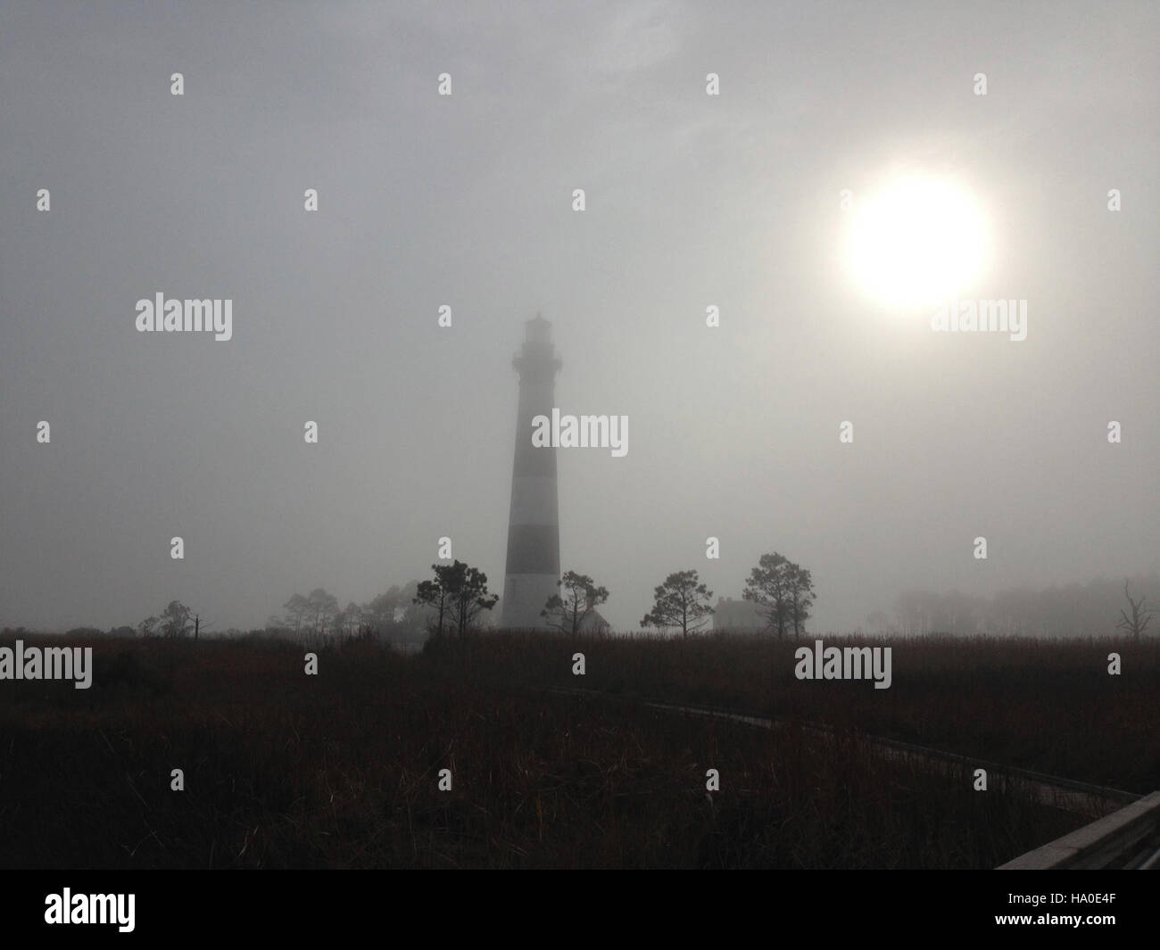 Fog envelops Bodie Island, part of Cape Hatteras National Seashore. The ...