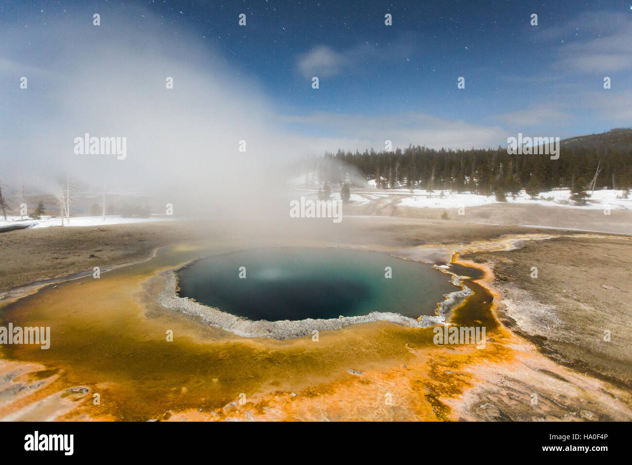 Crested Pool in Yellowstone National Park, illuminated by moonlight ...