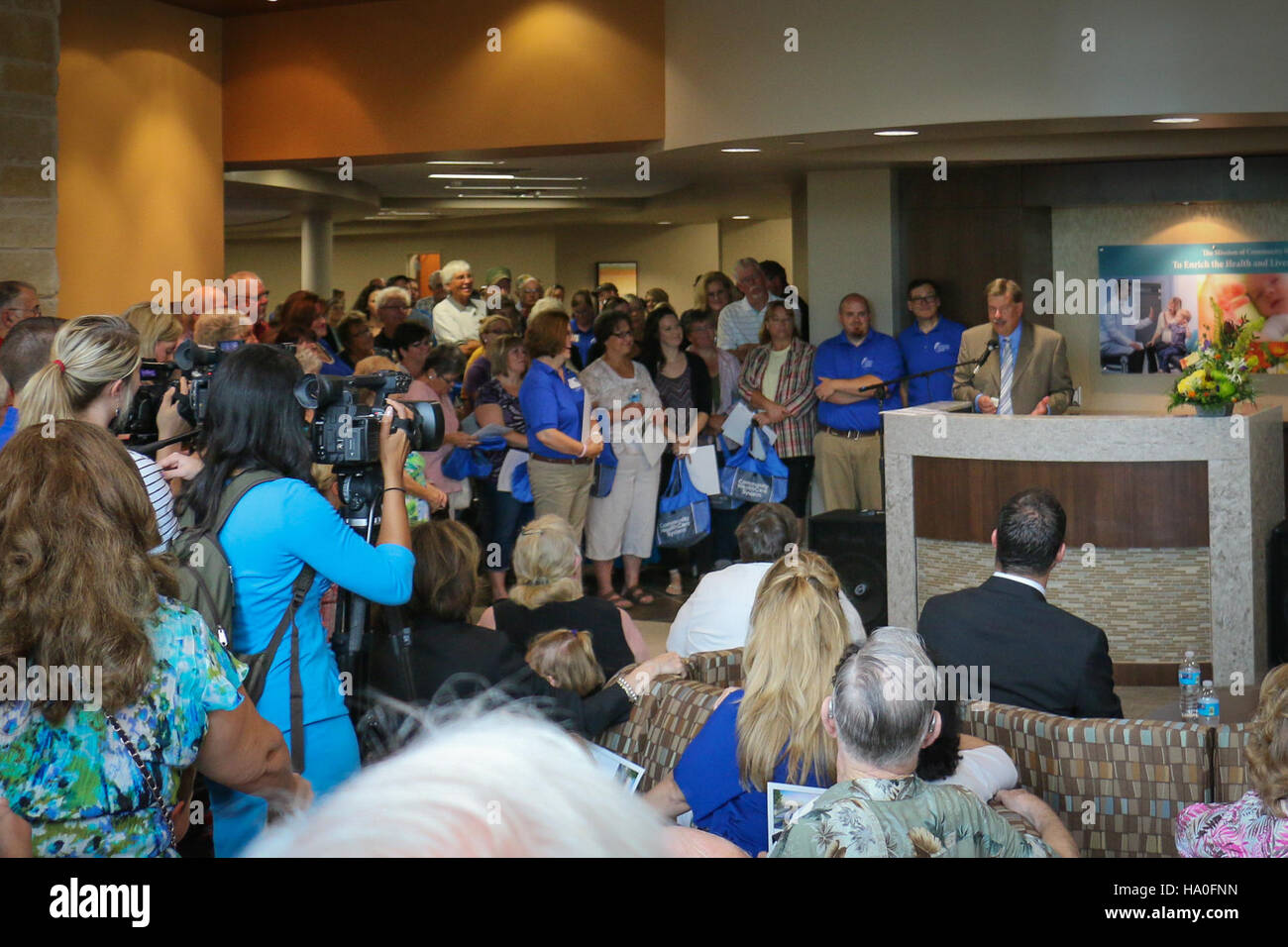 This image shows visitors inside the new Onaga Hospital lobby ...