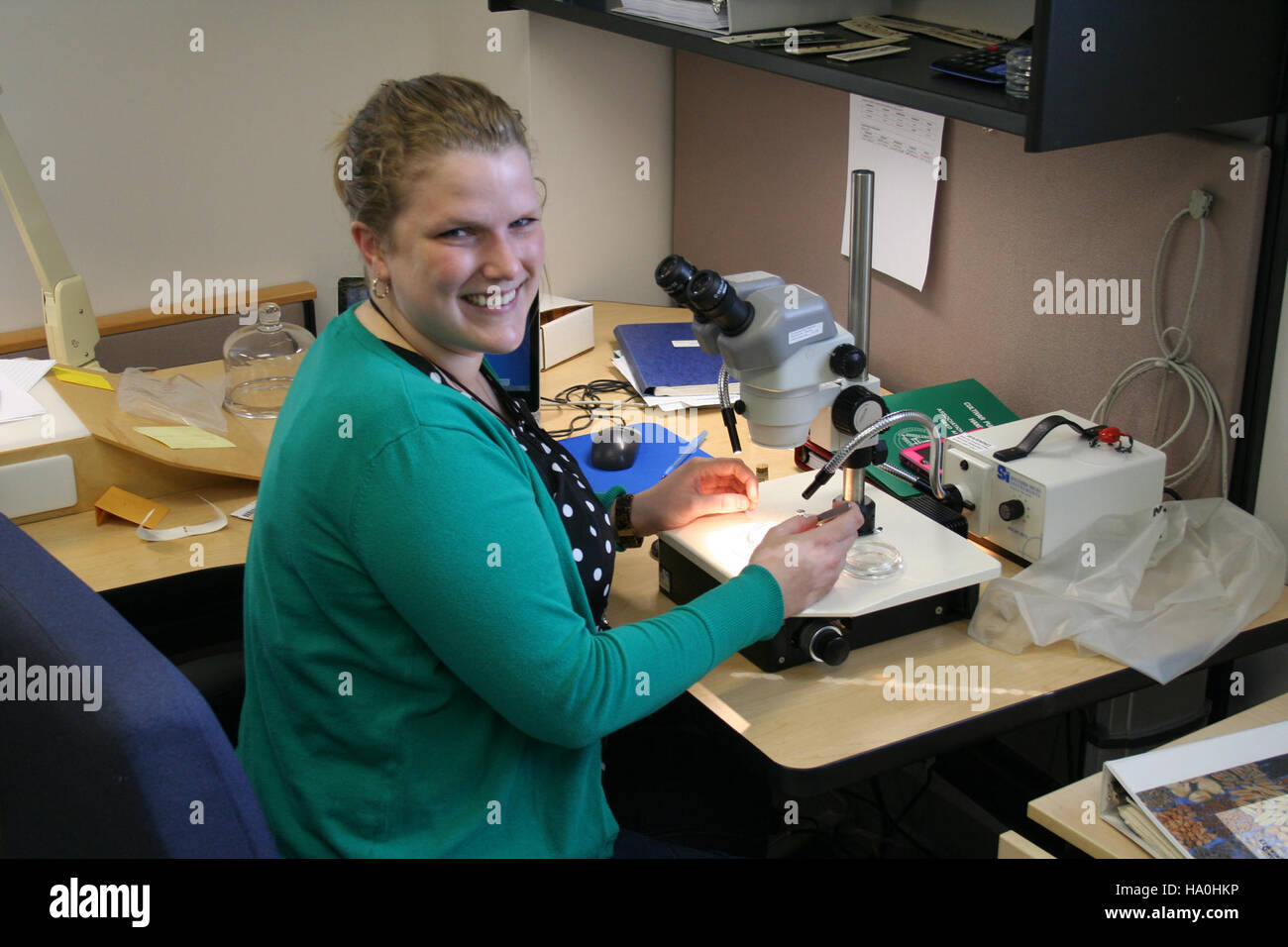 AMS Botanist Elizabeth Tatum identifies a weed seed, contributing to ...