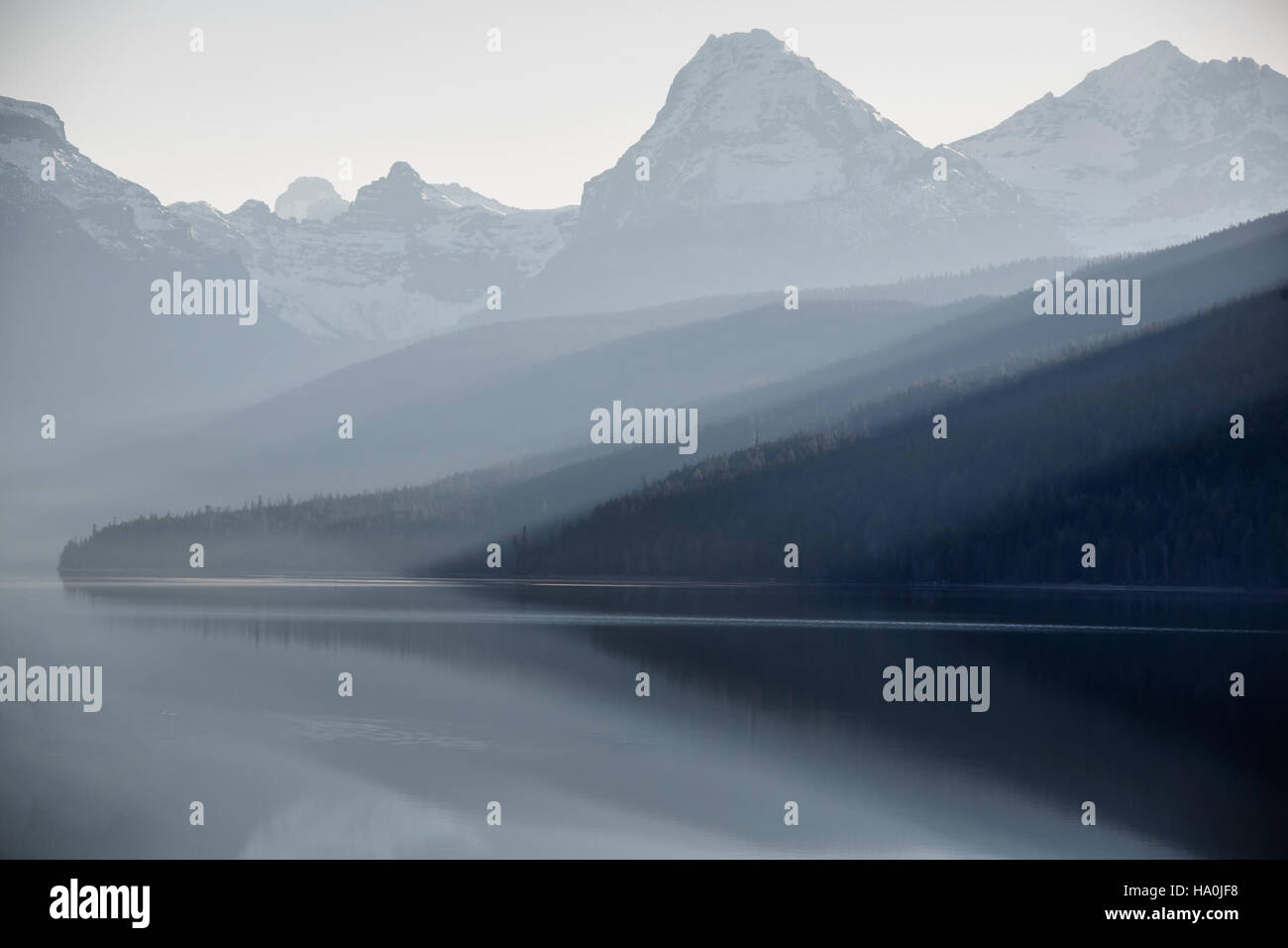 Morning mist shrouds the peaks and valleys of Glacier National Park ...