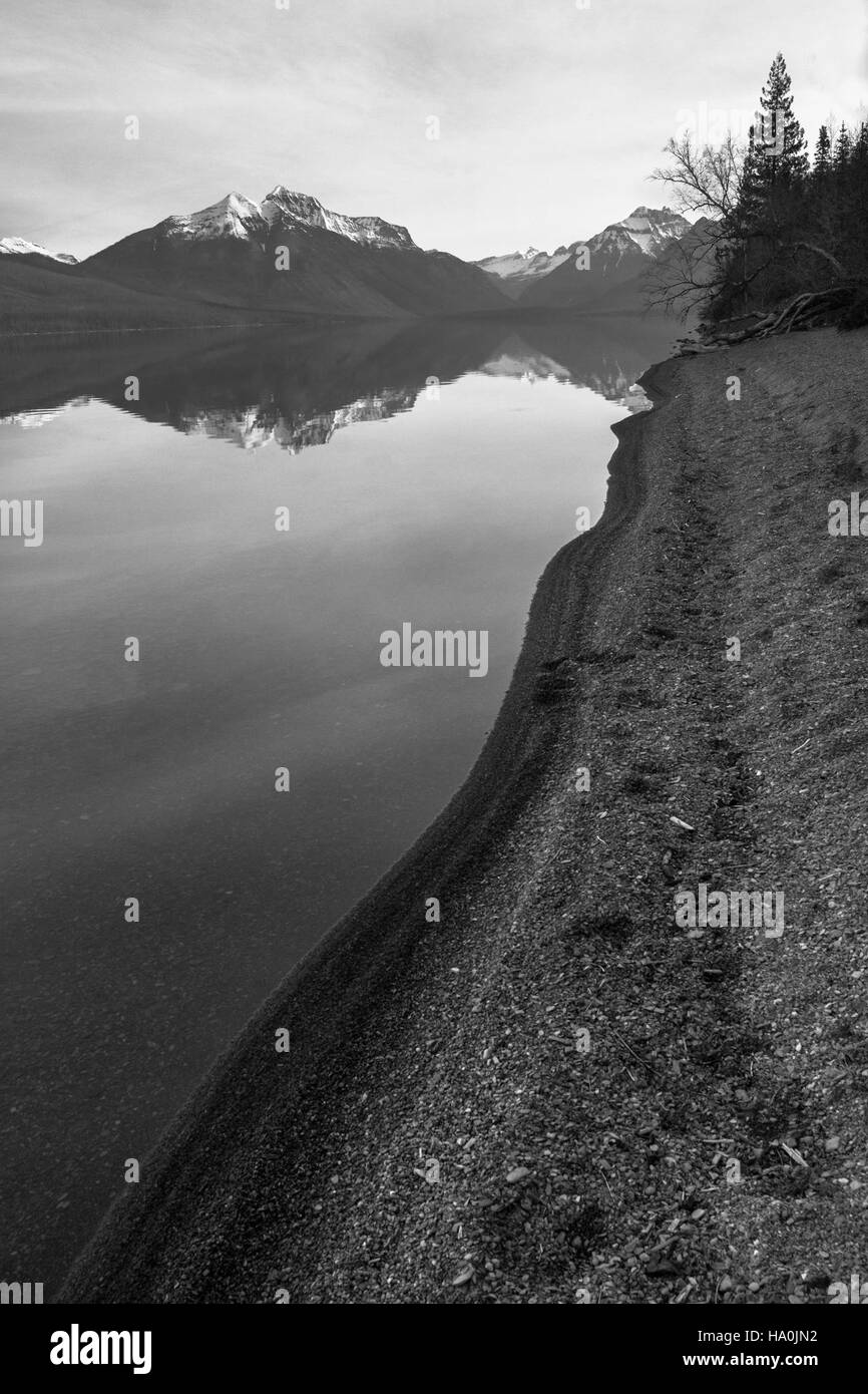 A photo capturing solitude on a beach within the Glacier National Park ...
