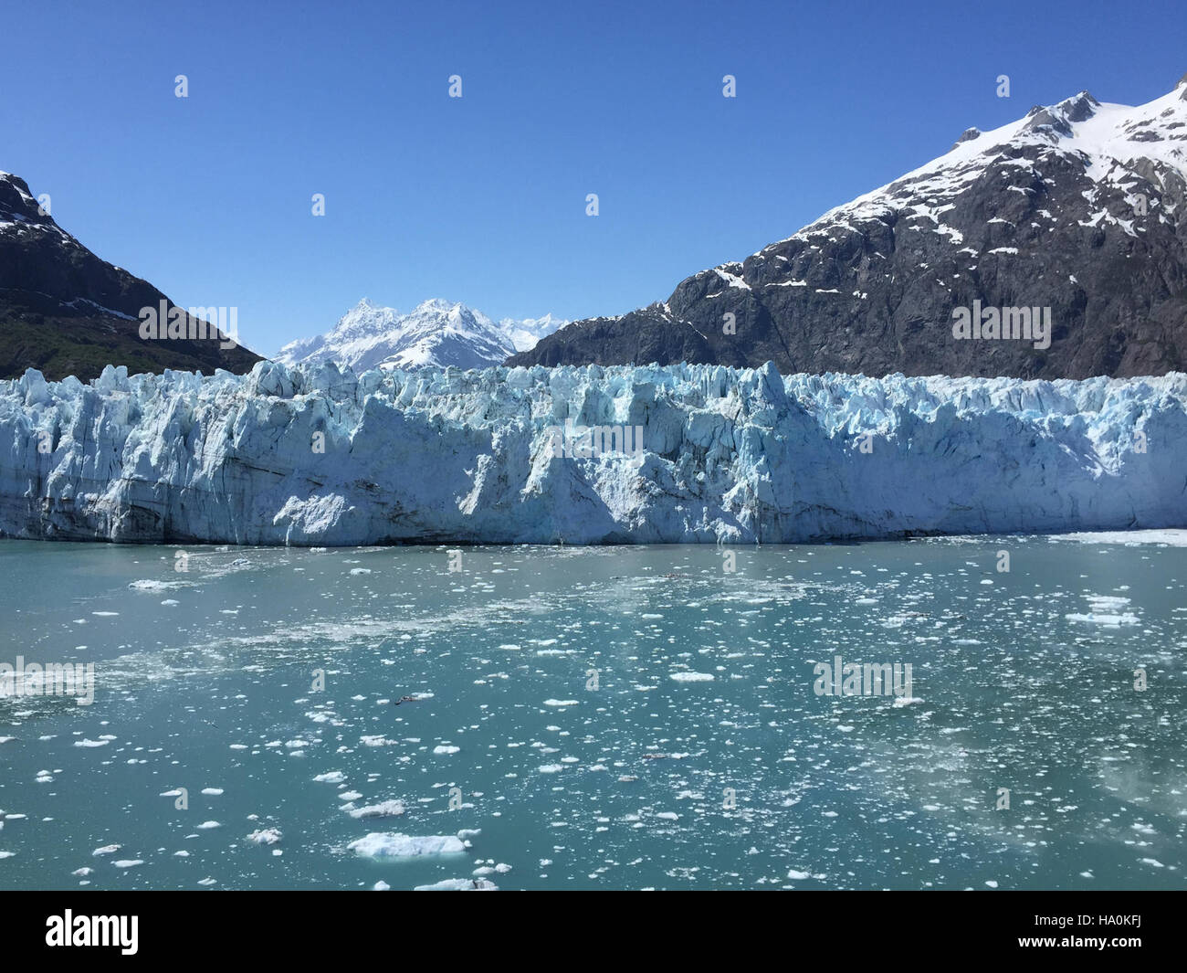 This image captures a glacier in Alaska’s mountainous terrain ...