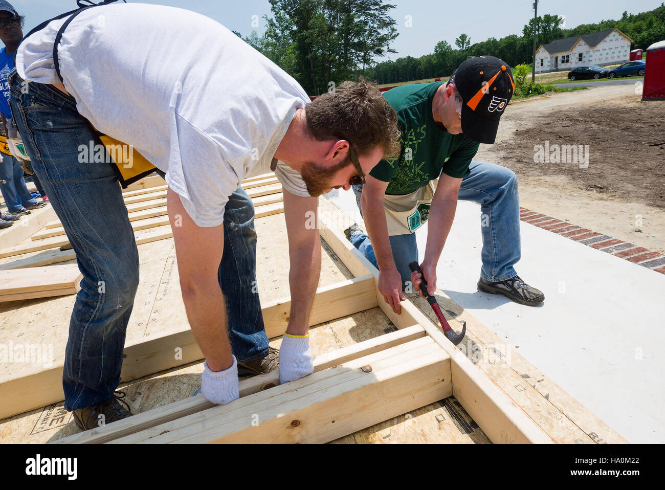 The image depicts a rural housing construction project under the USDA's ...