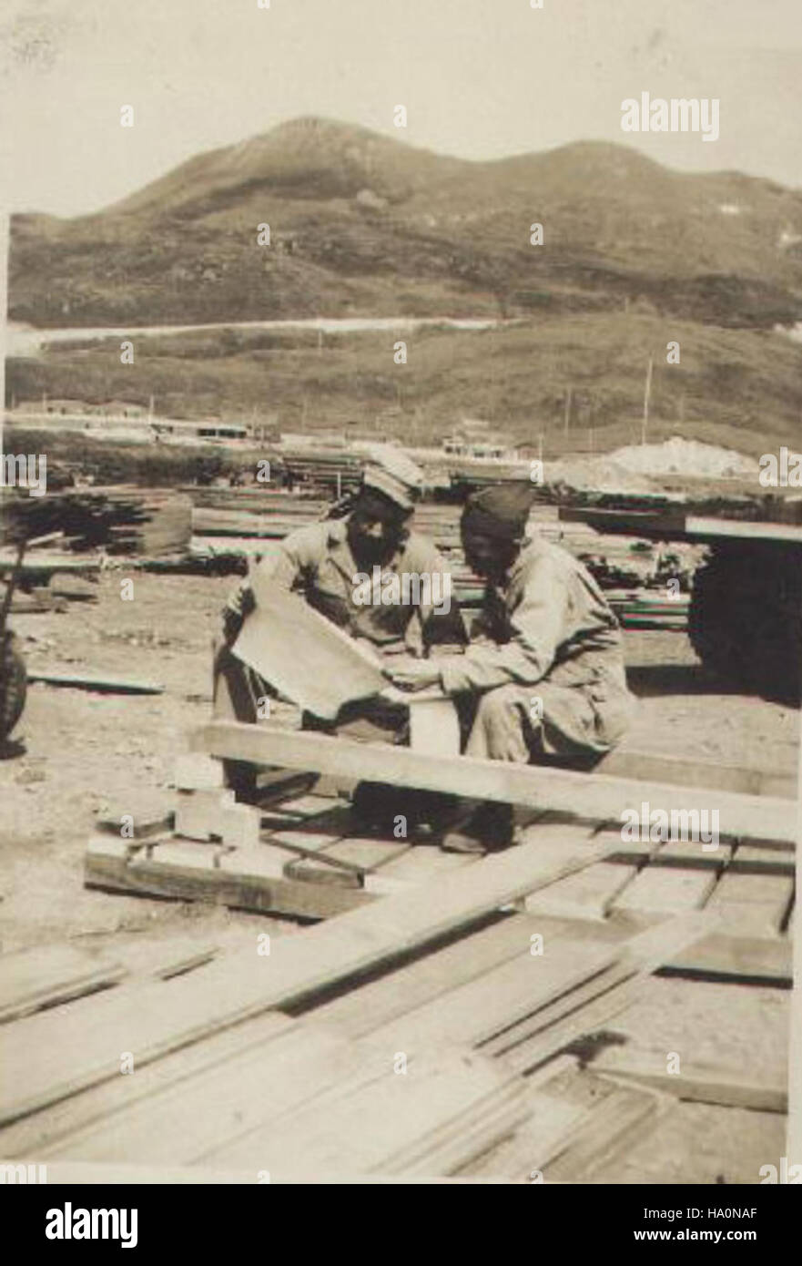 This historical image depicts a World War II era scene in Alaska ...