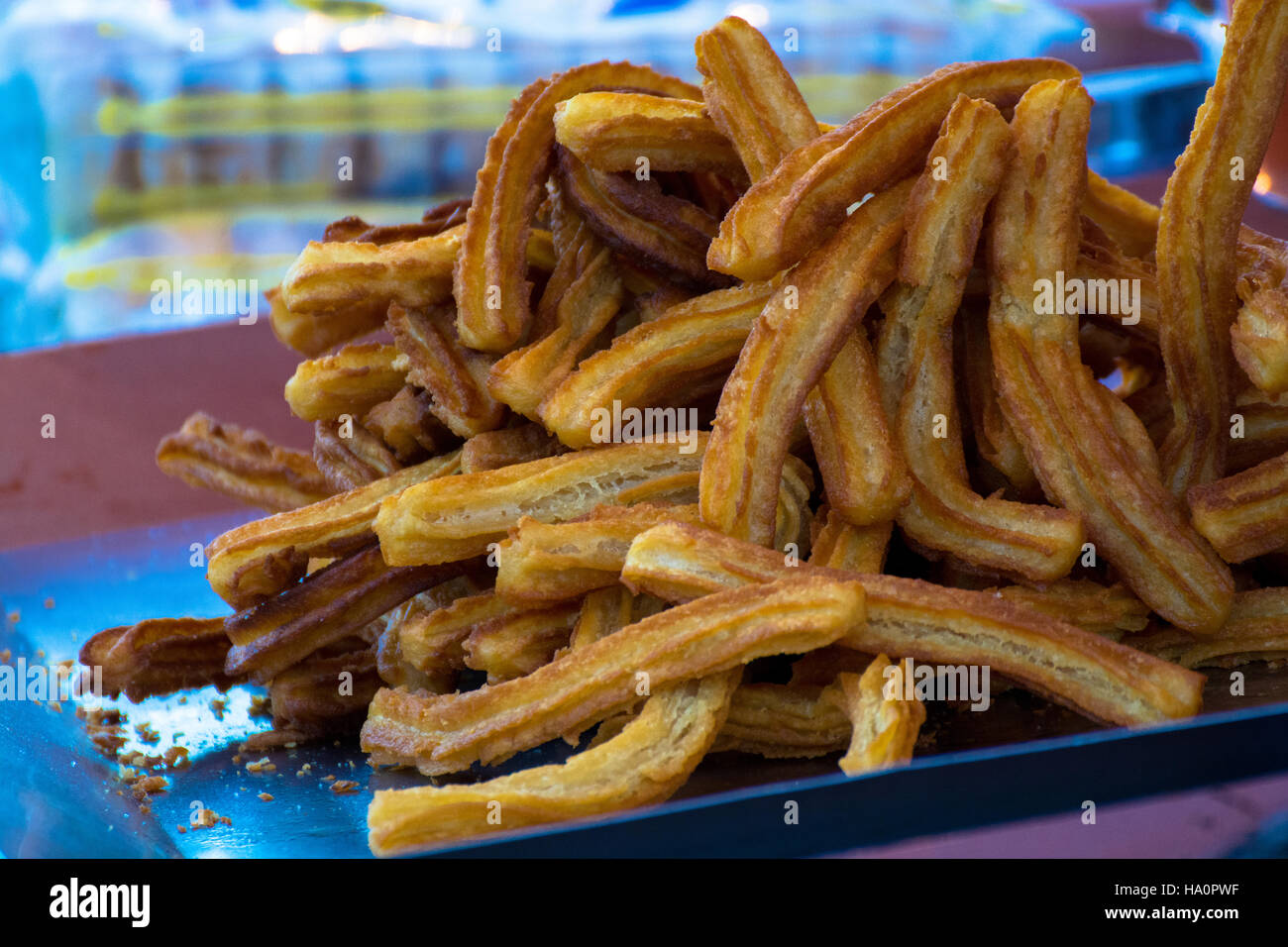 Close up of churros on market display for sale Stock Photo - Alamy