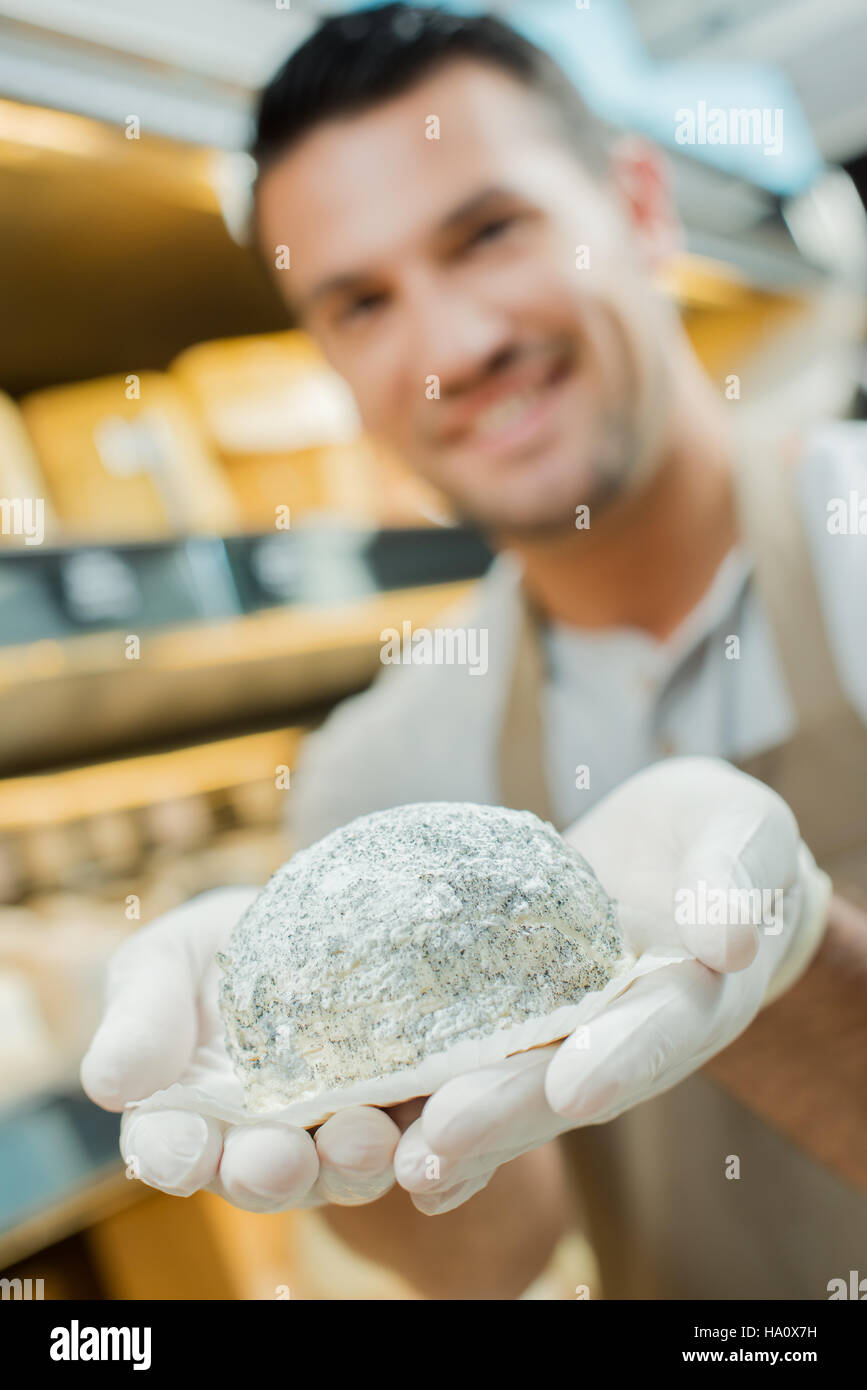 man presenting goatcheese Stock Photo - Alamy