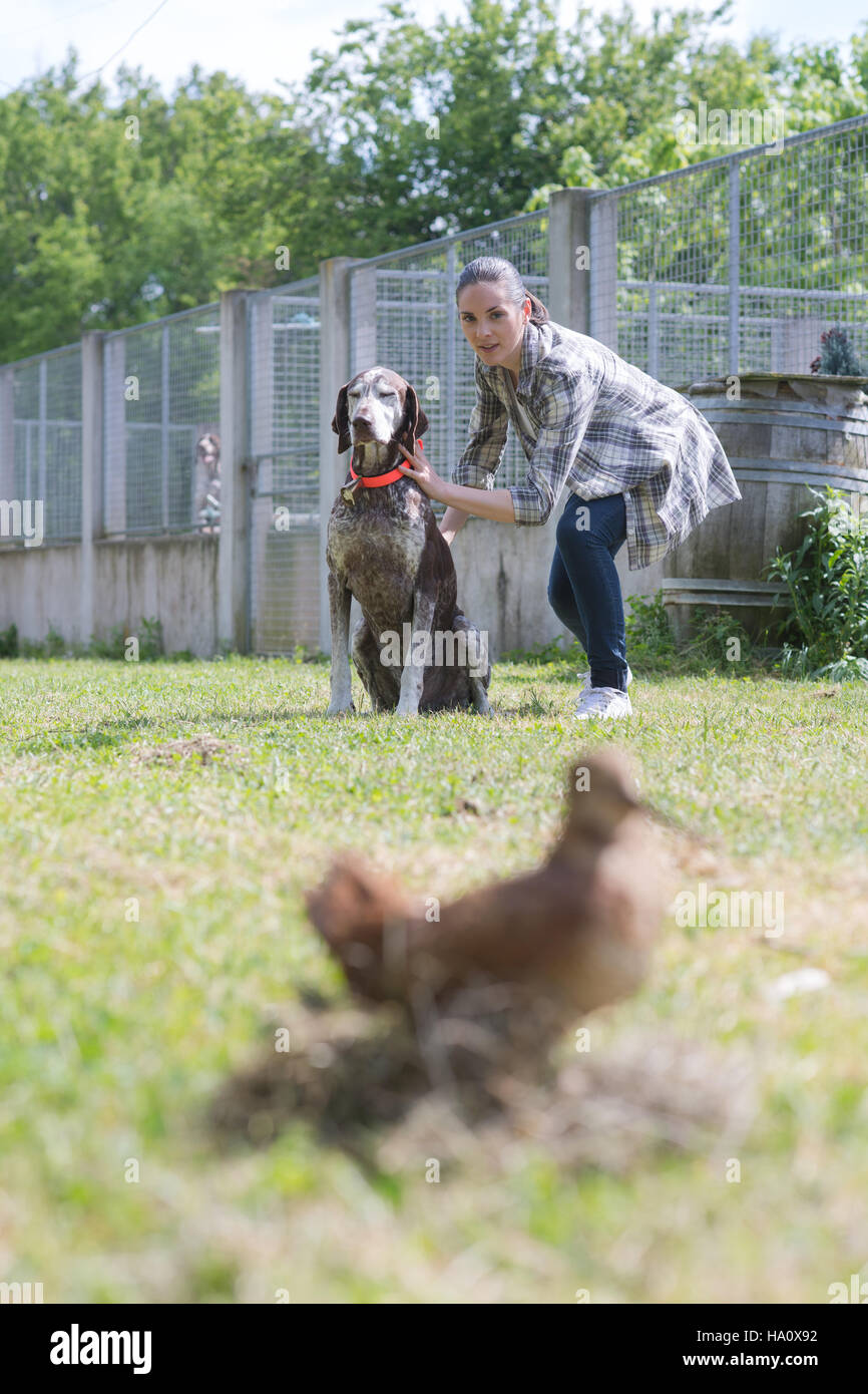 dedicated girl training dog in kennel Stock Photo - Alamy