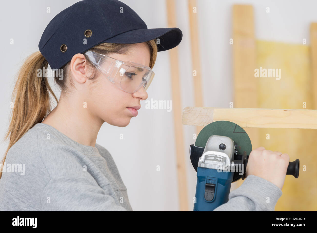 Woman using angle grinder hi-res stock photography and images - Alamy