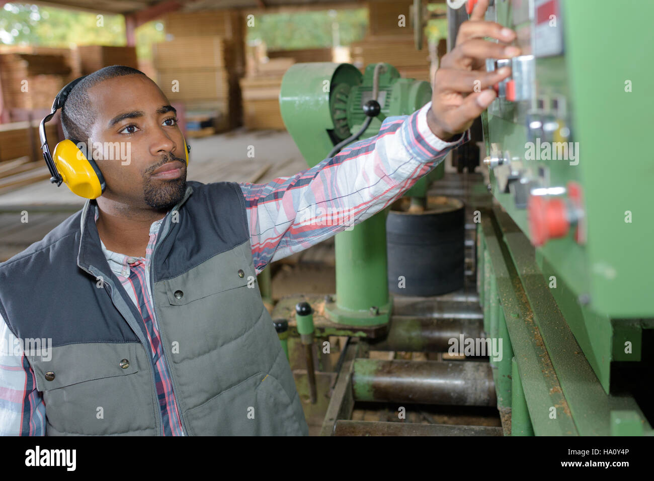 worker adjusting the machine Stock Photo - Alamy