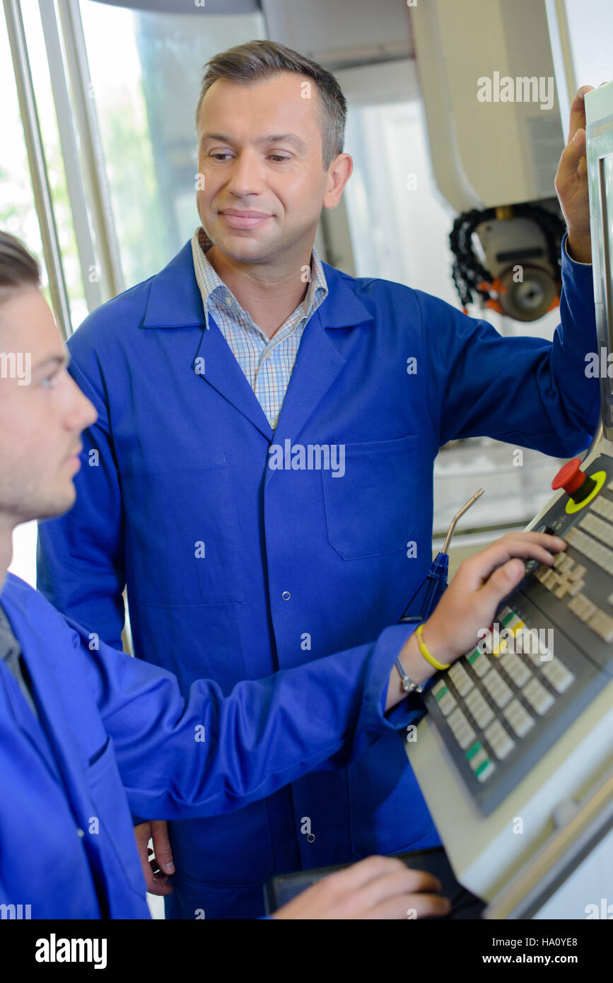 pressing the machine buttons Stock Photo - Alamy