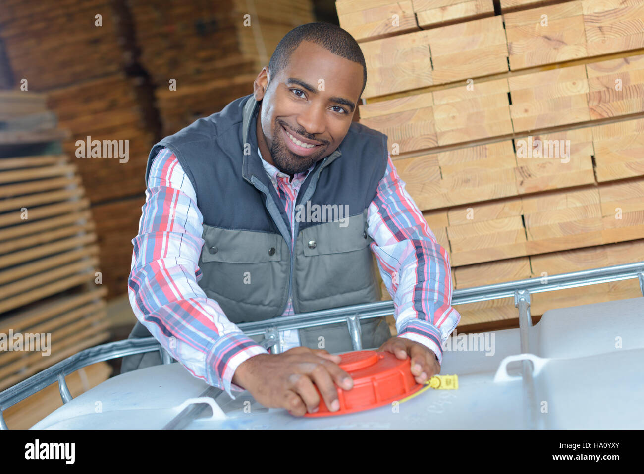 worker posing and smiling Stock Photo - Alamy