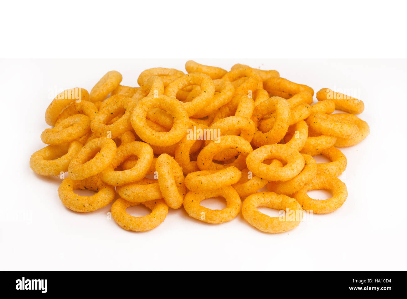 side view of many round potato snacks isolated on white background ...