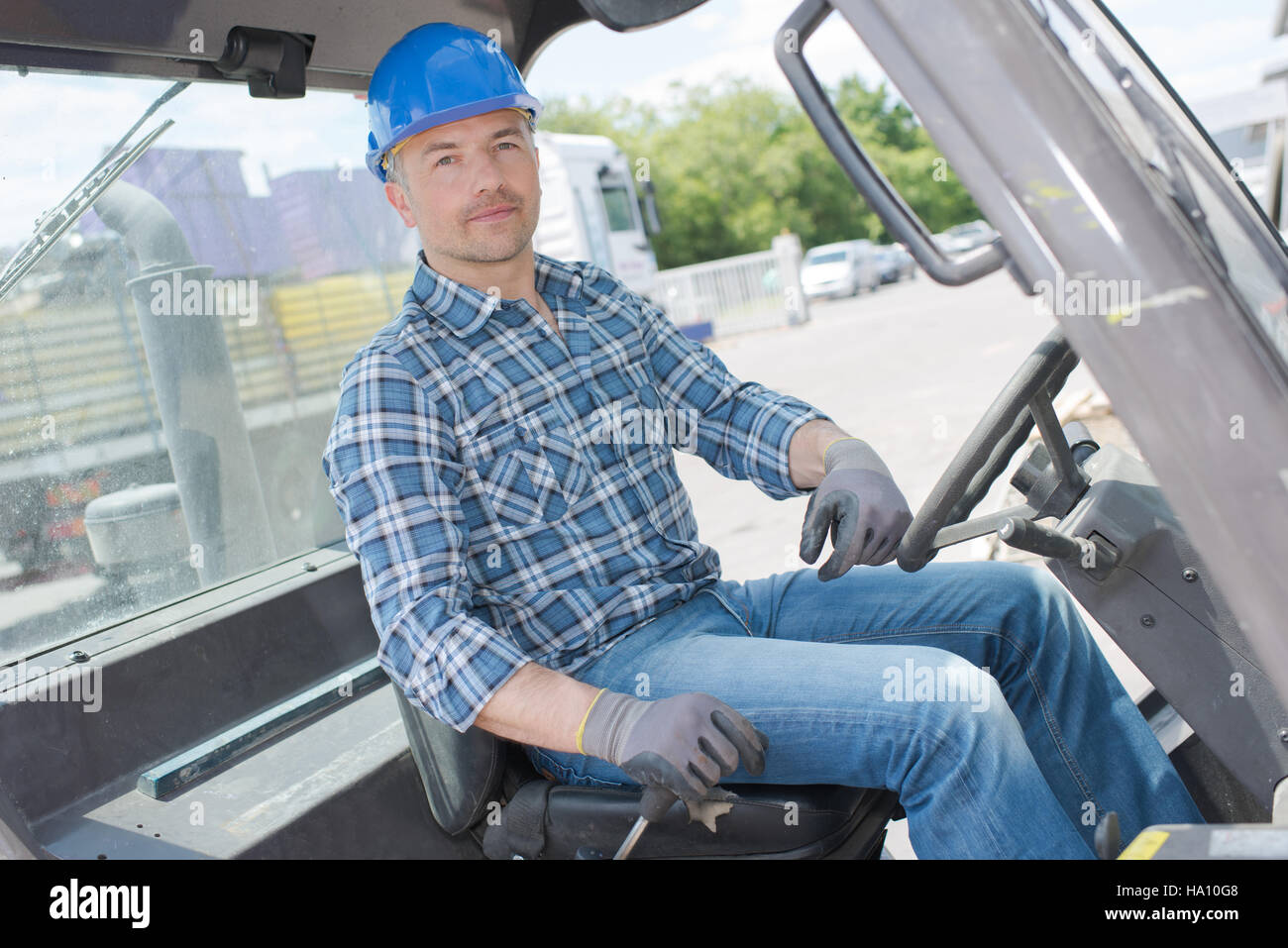Portrait of male forklift driver Stock Photo - Alamy
