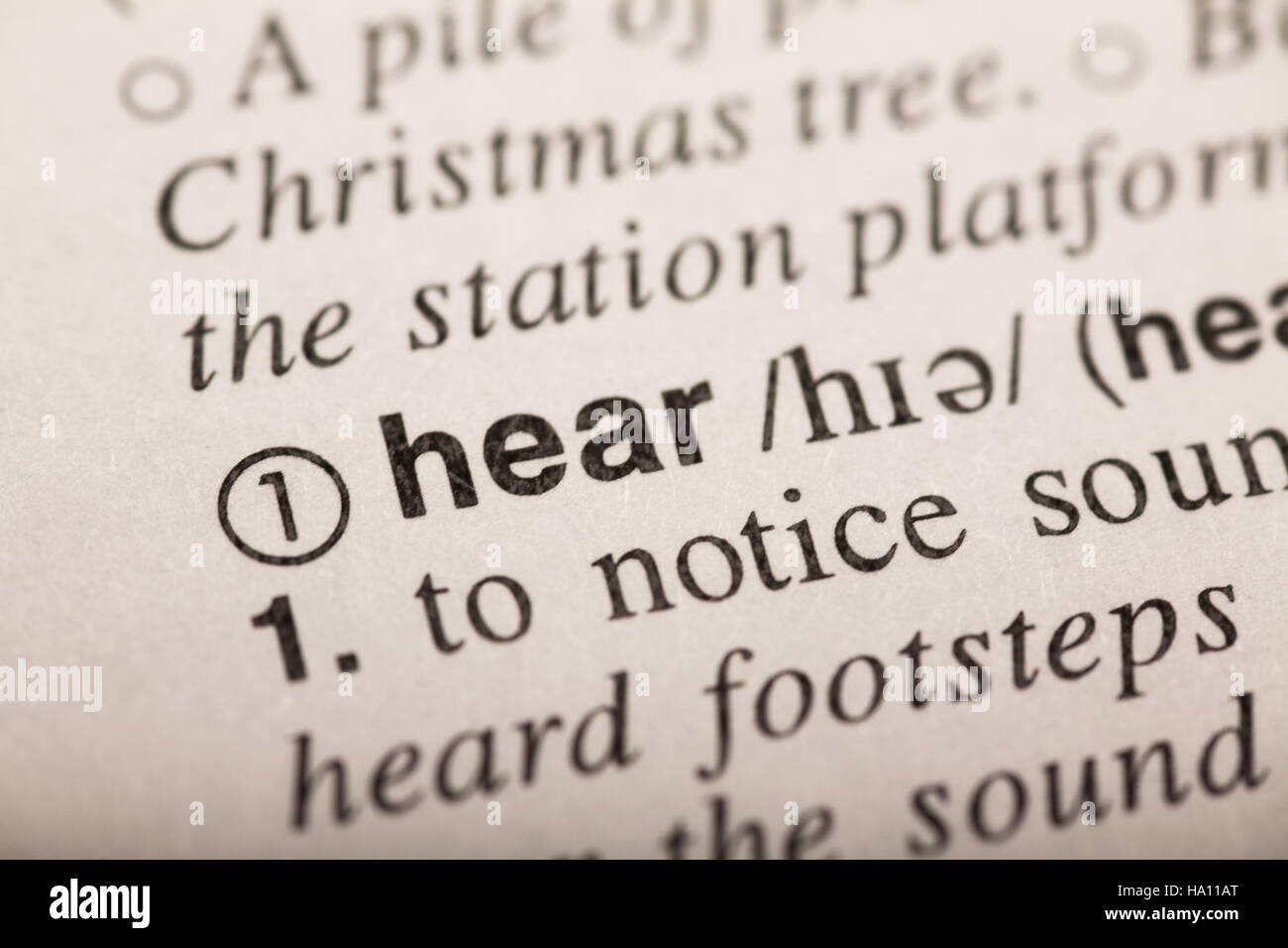 hear - word in dictionary Stock Photo - Alamy