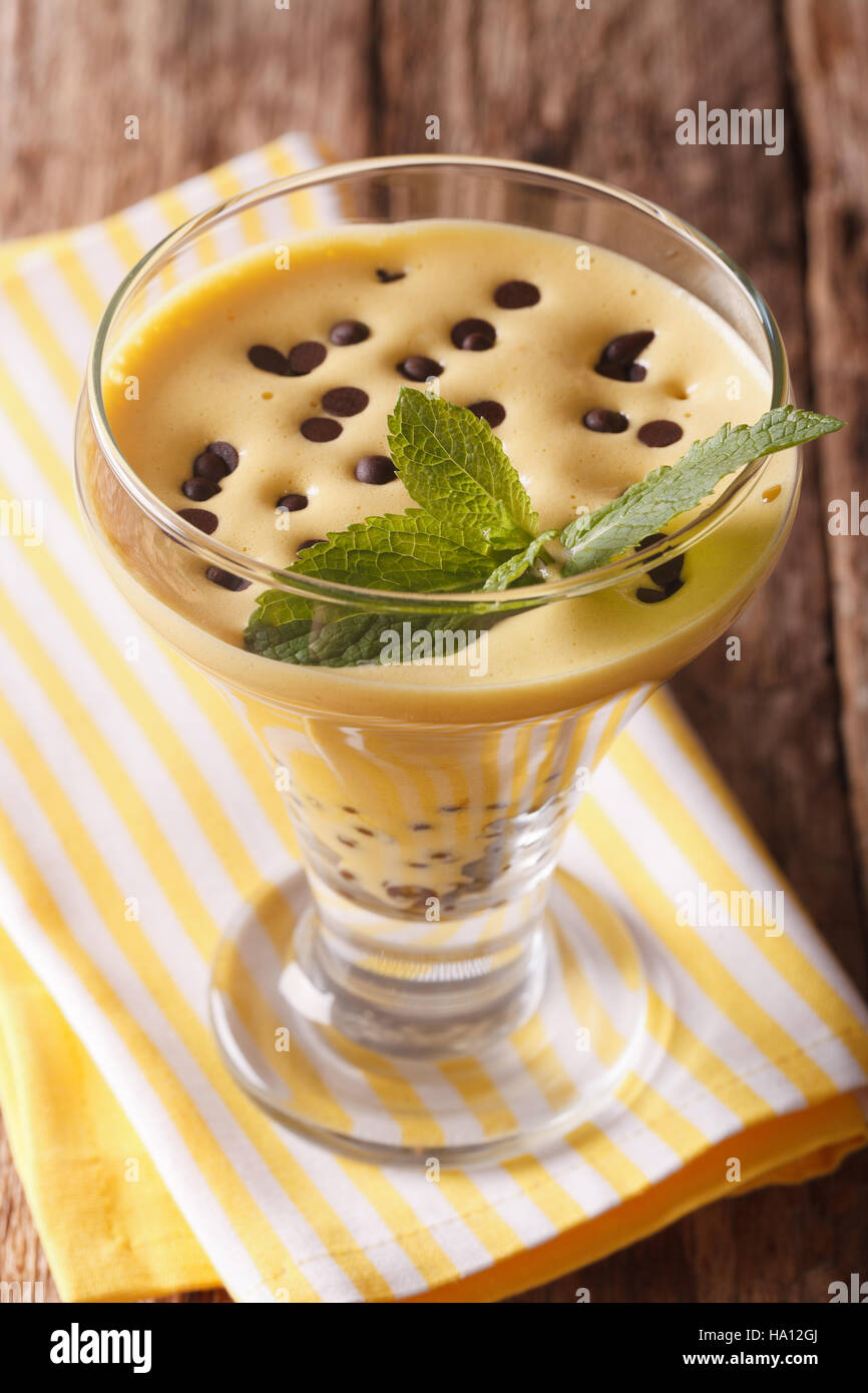 Italian egg cream Zabaione with chocolate close up in a glass on the ...